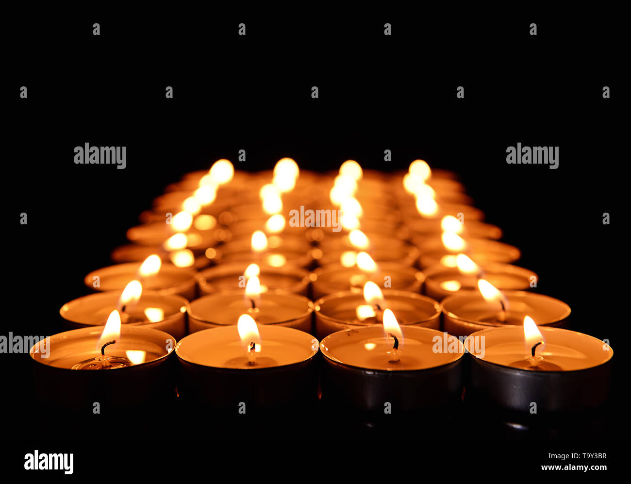 Beautiful burning candles on dark background Stock Photo - Alamy