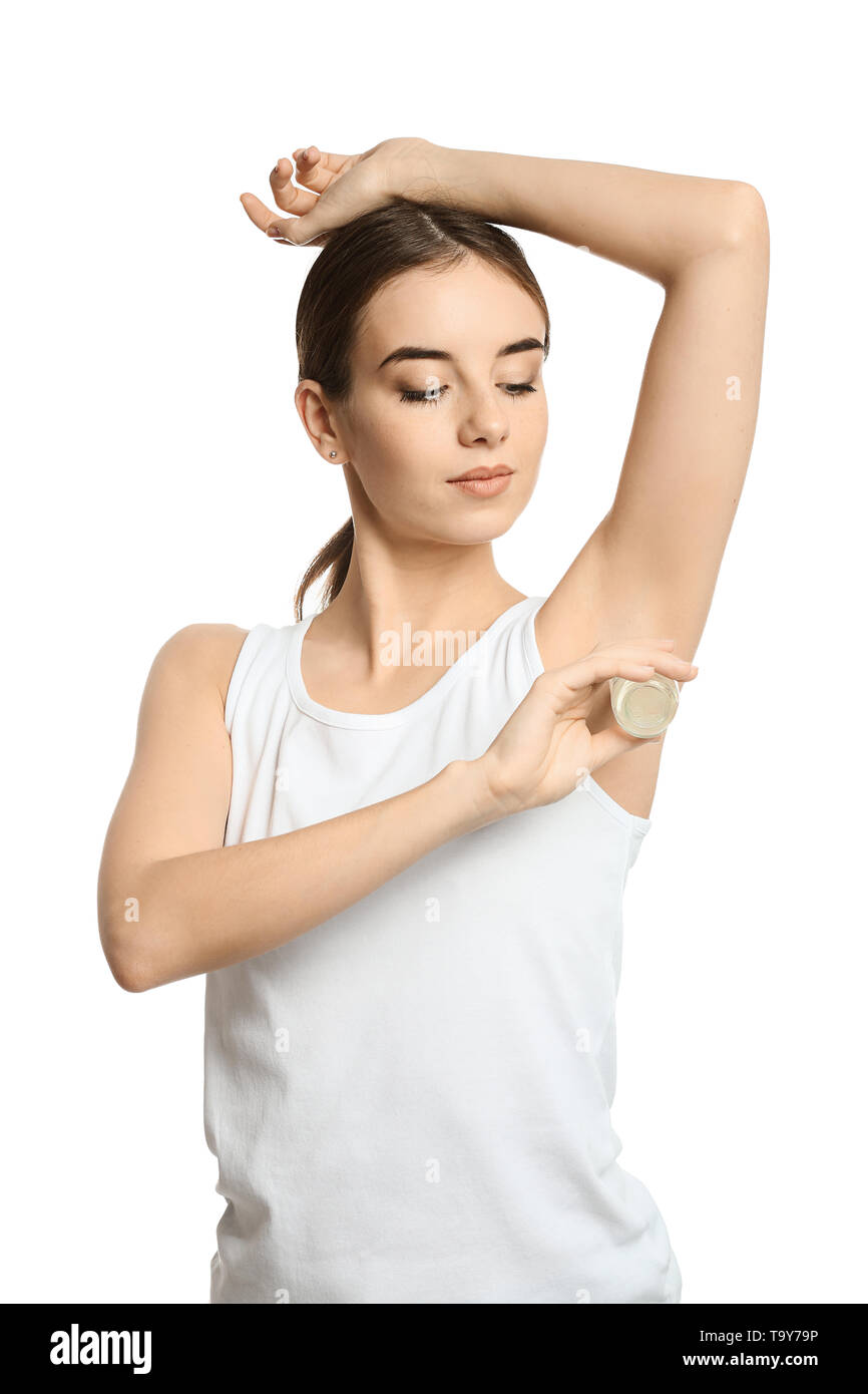 Beautiful young woman with deodorant on white background Stock Photo ...