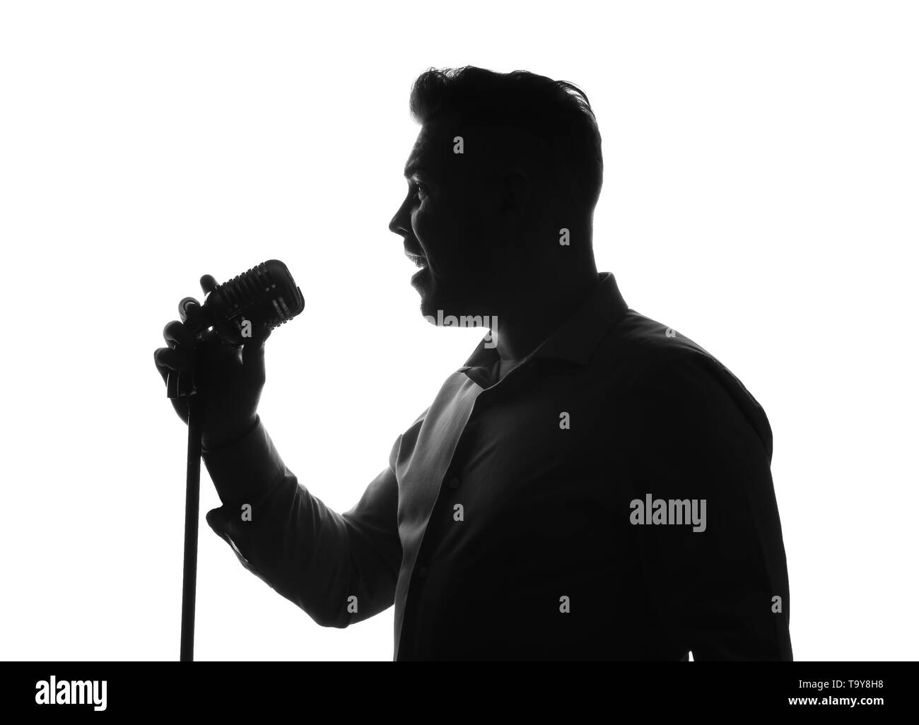 Silhouette of male singer on white background Stock Photo - Alamy