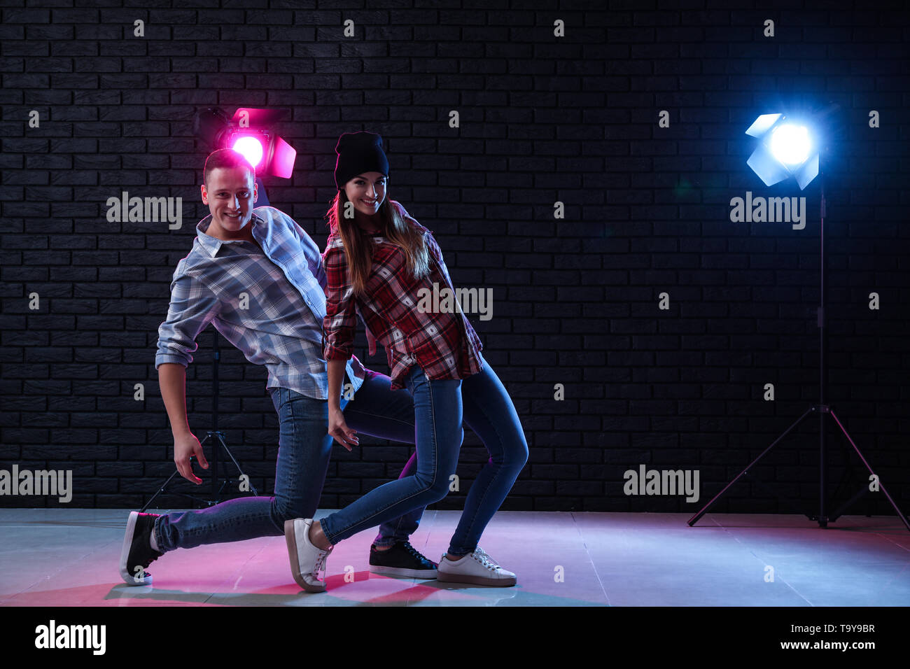 Young couple dancing in club Stock Photo - Alamy