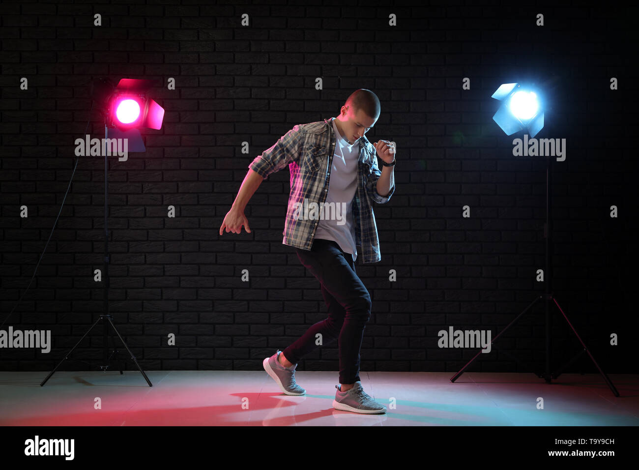 Young man dancing in club Stock Photo - Alamy