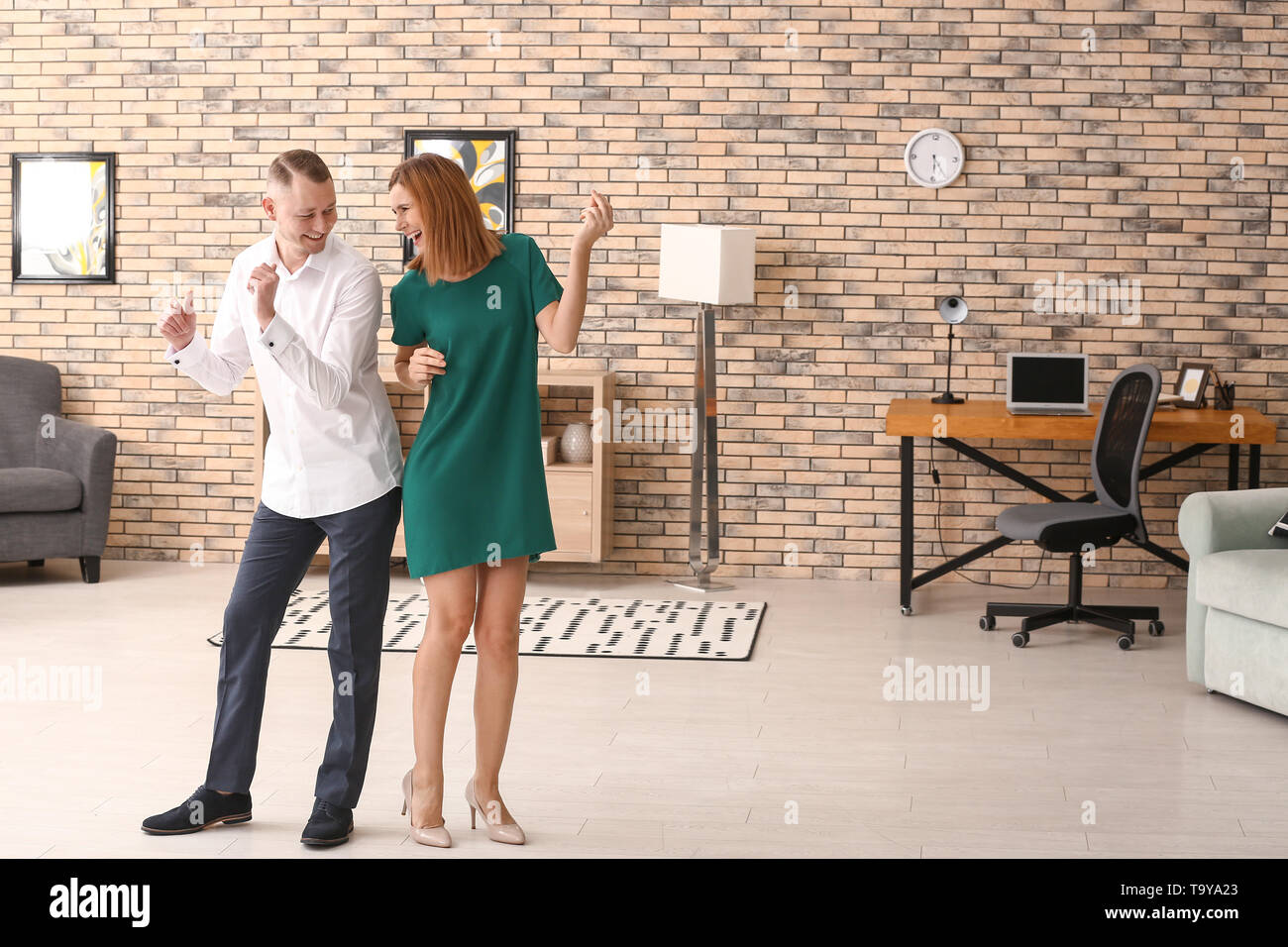 Beautiful couple dancing at home Stock Photo - Alamy