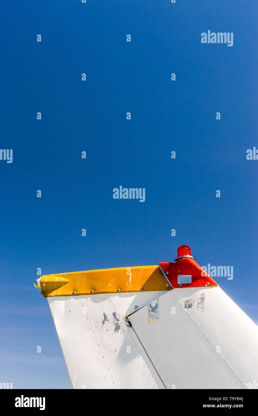 Tail fin, rudder and beacon lights, small single engine airplane with ...