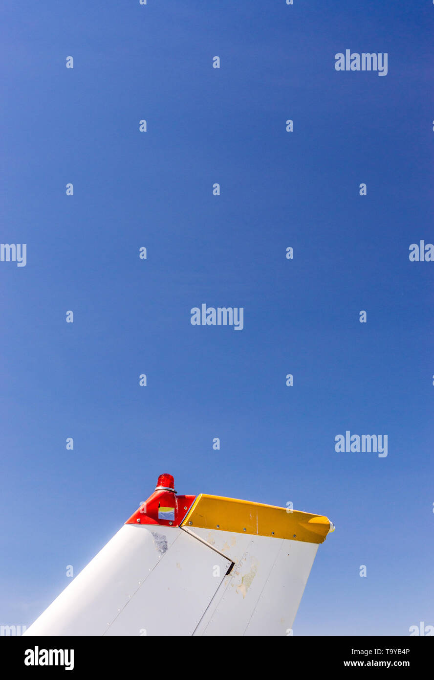 Tail fin, rudder and beacon lights, small single engine airplane with ...