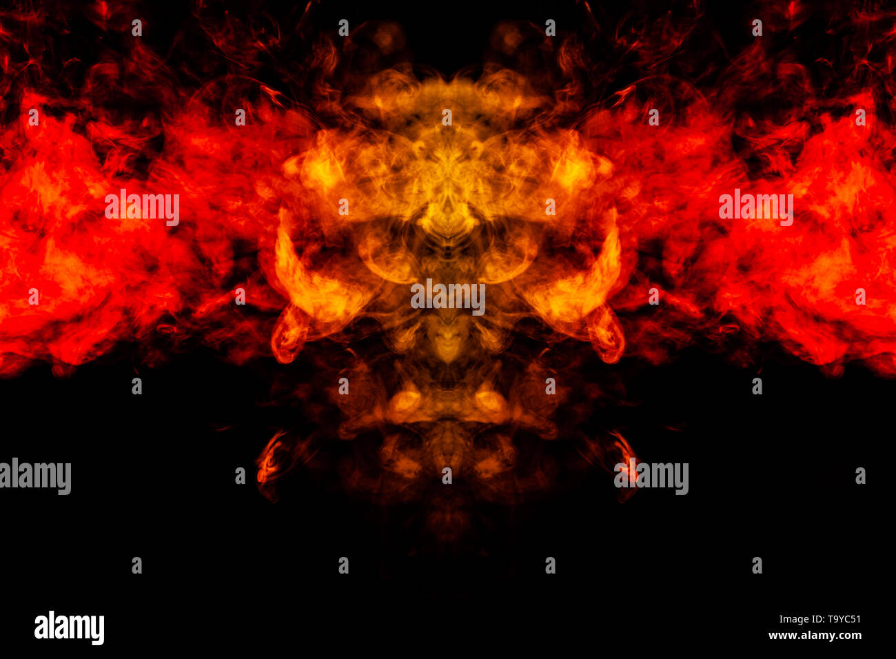 Smoke of different orange and red colors in the form of horror in the ...