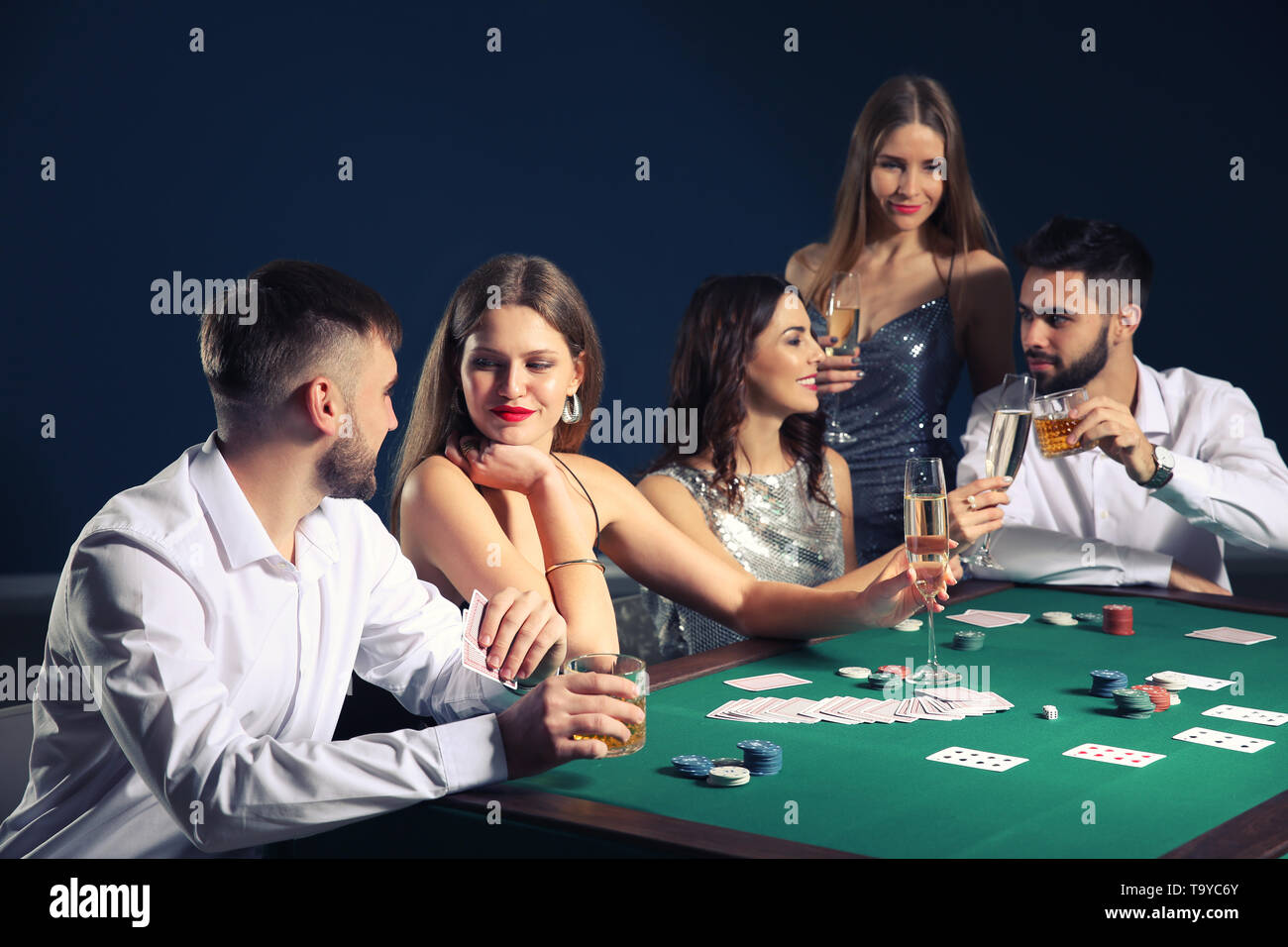 Young group people gambling in hi-res stock photography and images - Alamy