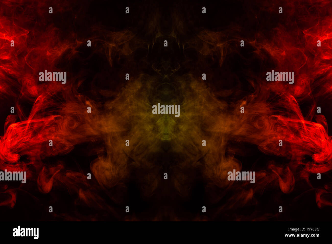 Smoke of different orange and red colors in the form of horror in the ...