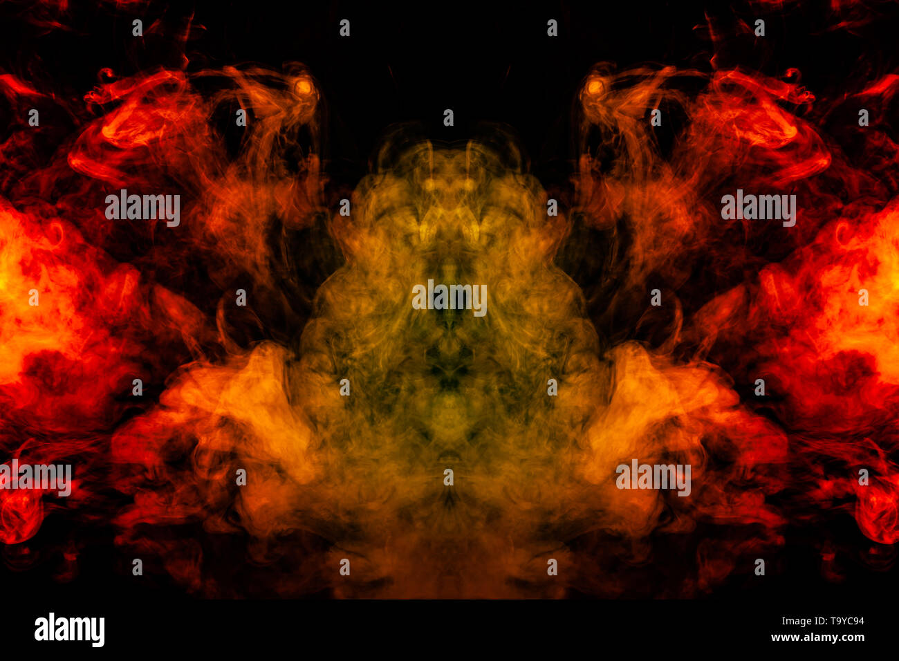 Smoke of different orange and red colors in the form of horror in the ...
