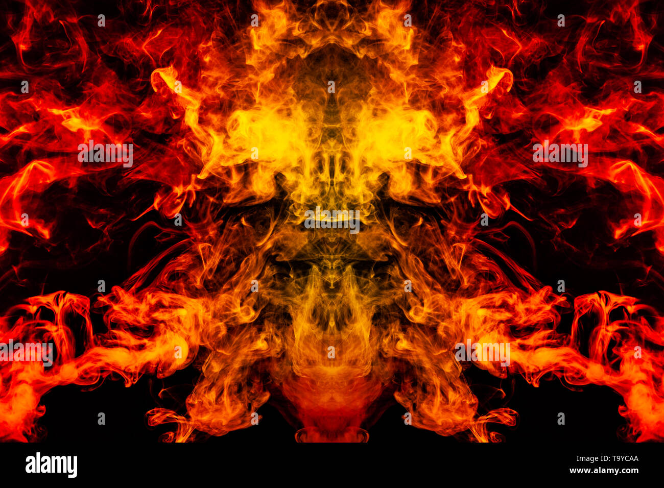 Smoke of different orange and red colors in the form of horror in the ...