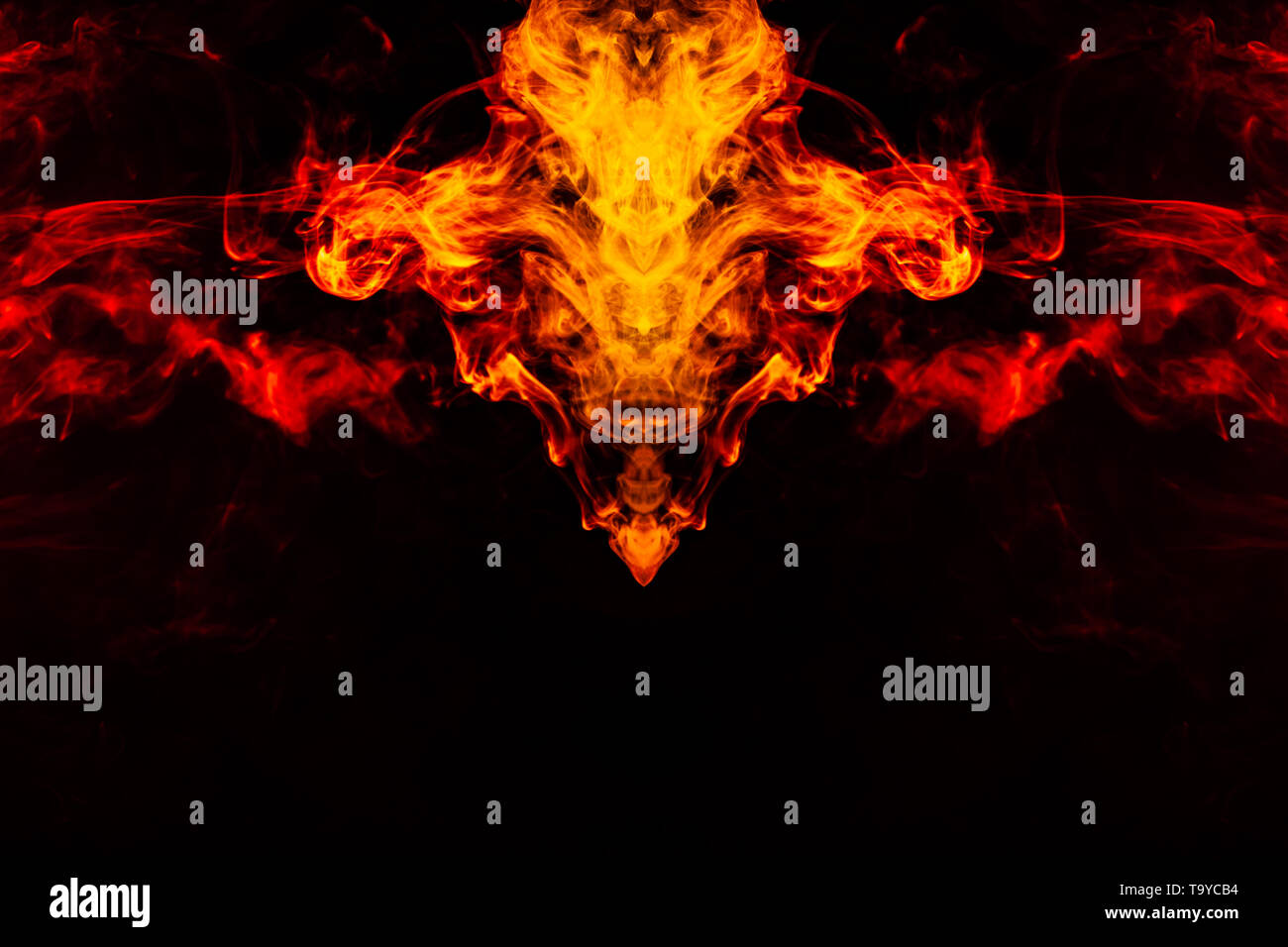 Smoke of different orange and red colors in the form of horror in the ...