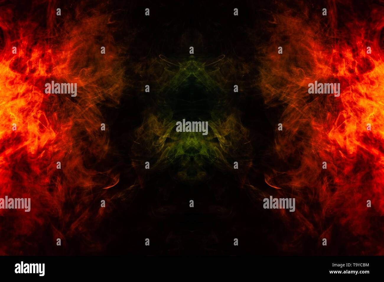 Smoke of different orange and red colors in the form of horror in the ...