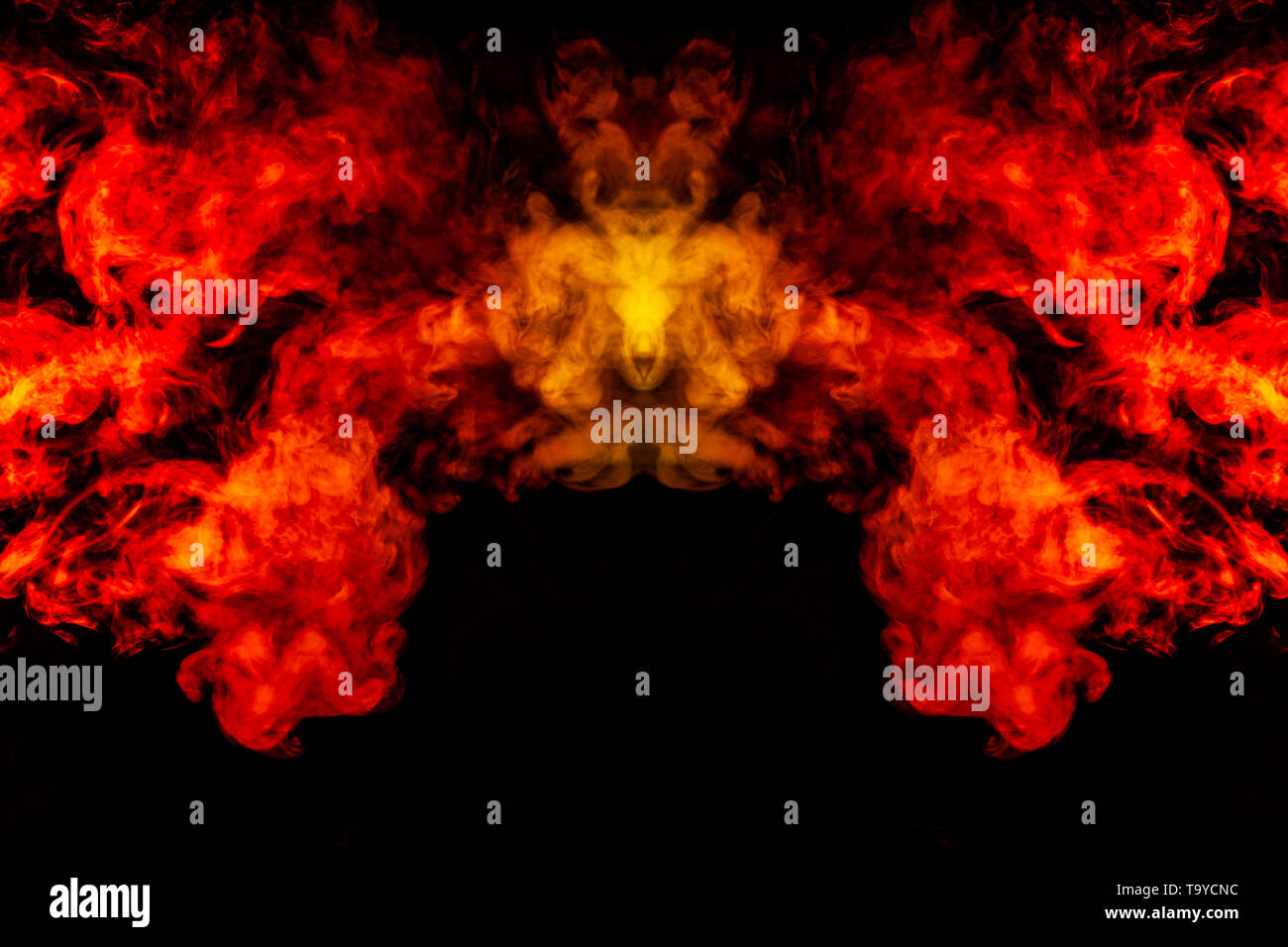 Smoke of different orange and red colors in the form of horror in the ...