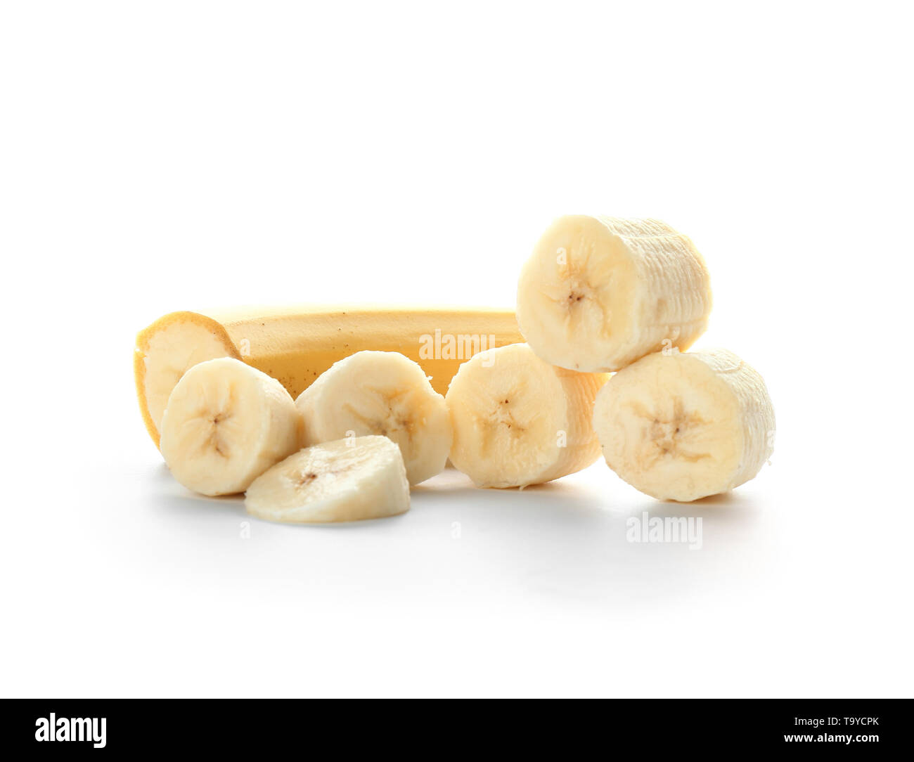Tasty cut banana on white background Stock Photo - Alamy