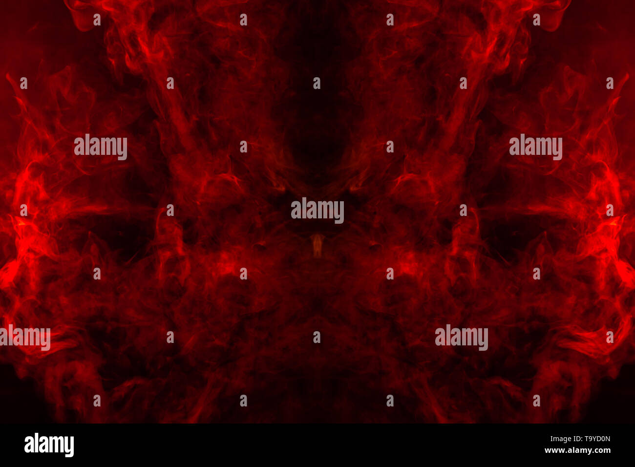 Smoke of different orange and red colors in the form of horror in the ...