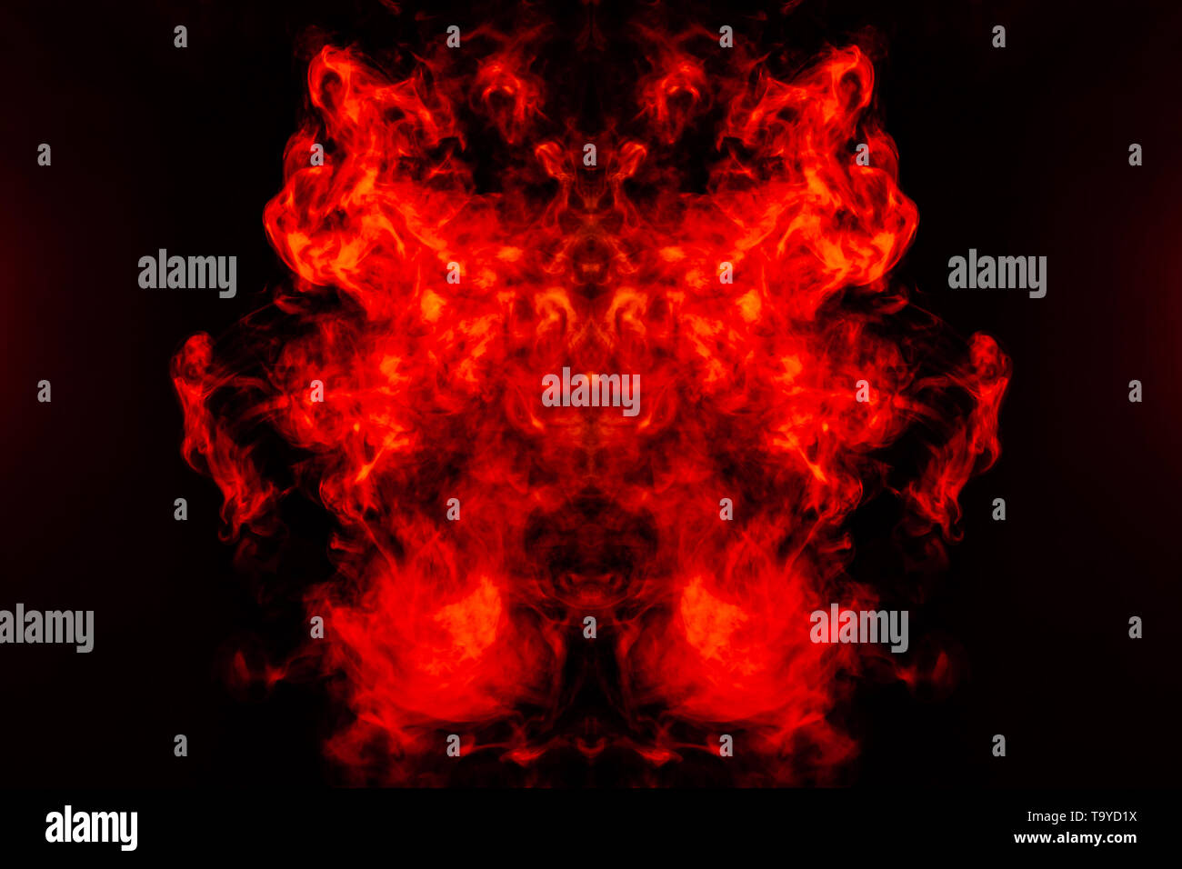 Smoke of different orange and red colors in the form of horror in the ...