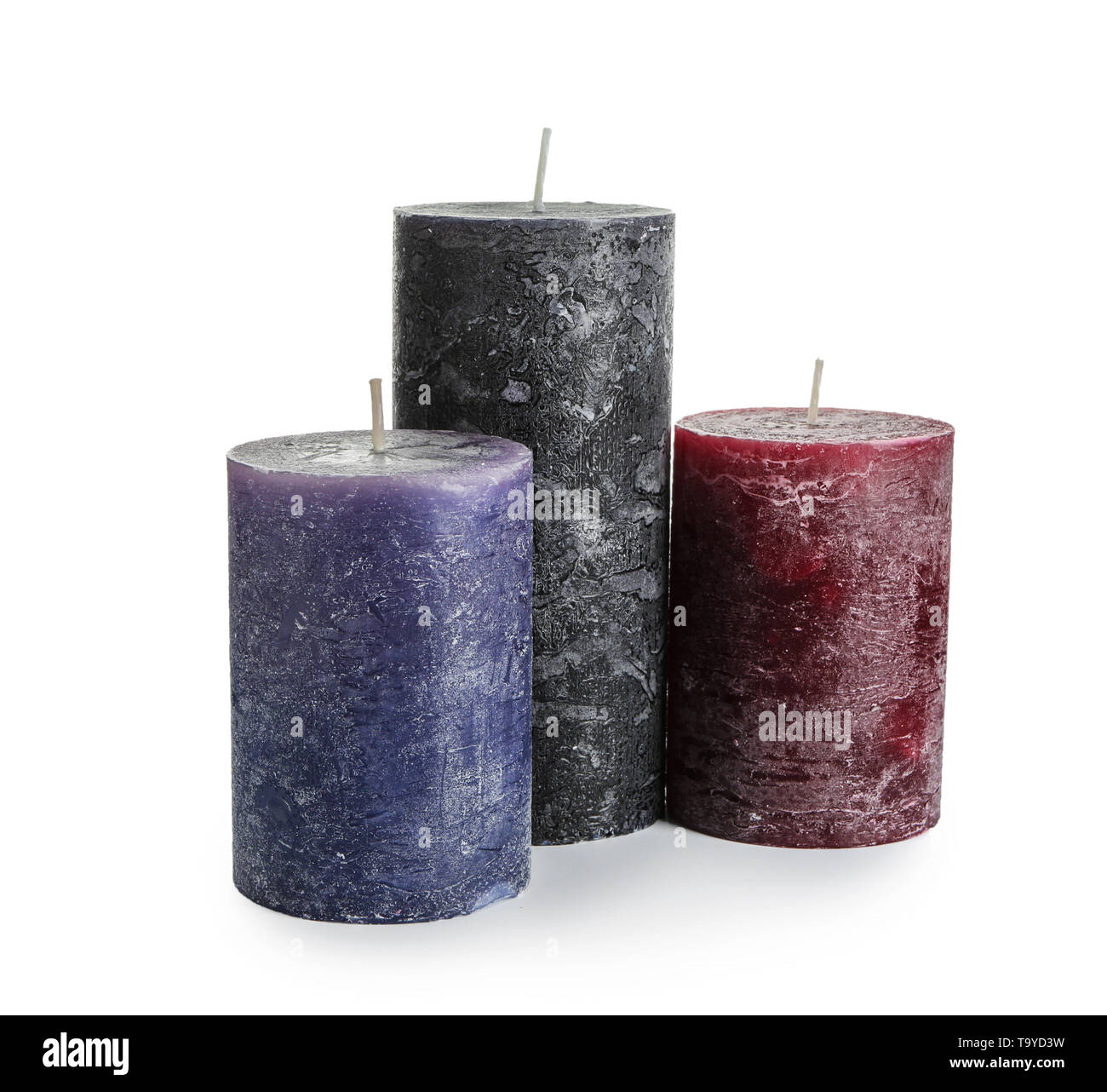 Different wax candles on white background Stock Photo - Alamy