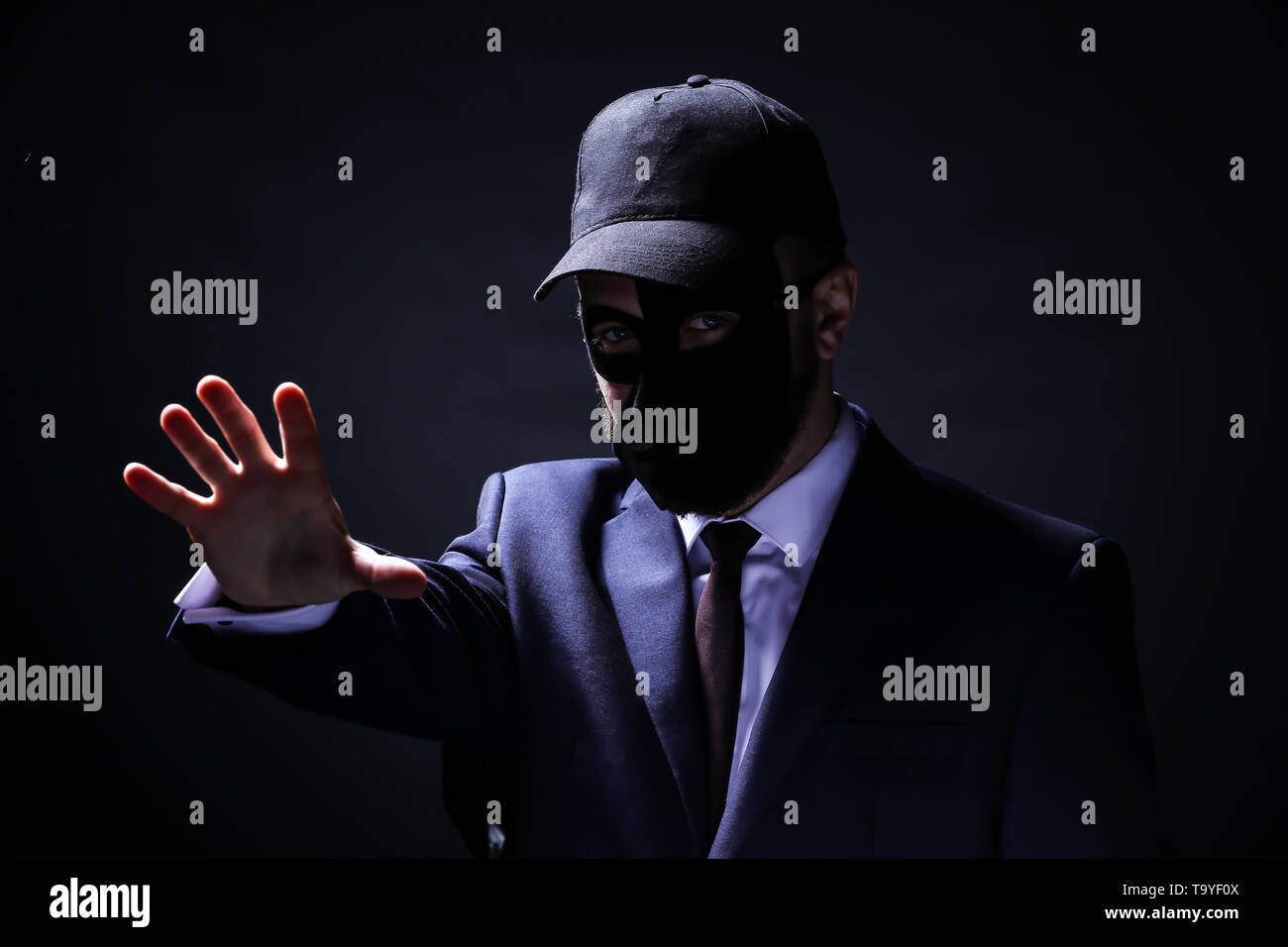 Professional hacker on dark background. Concept of internet theft Stock ...