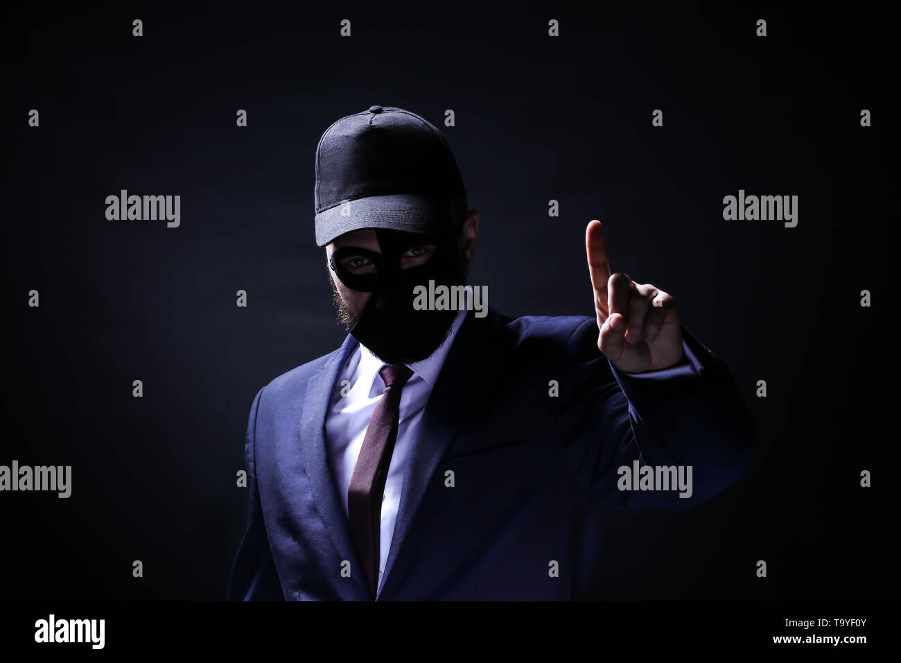 Professional hacker on dark background. Concept of internet theft Stock ...