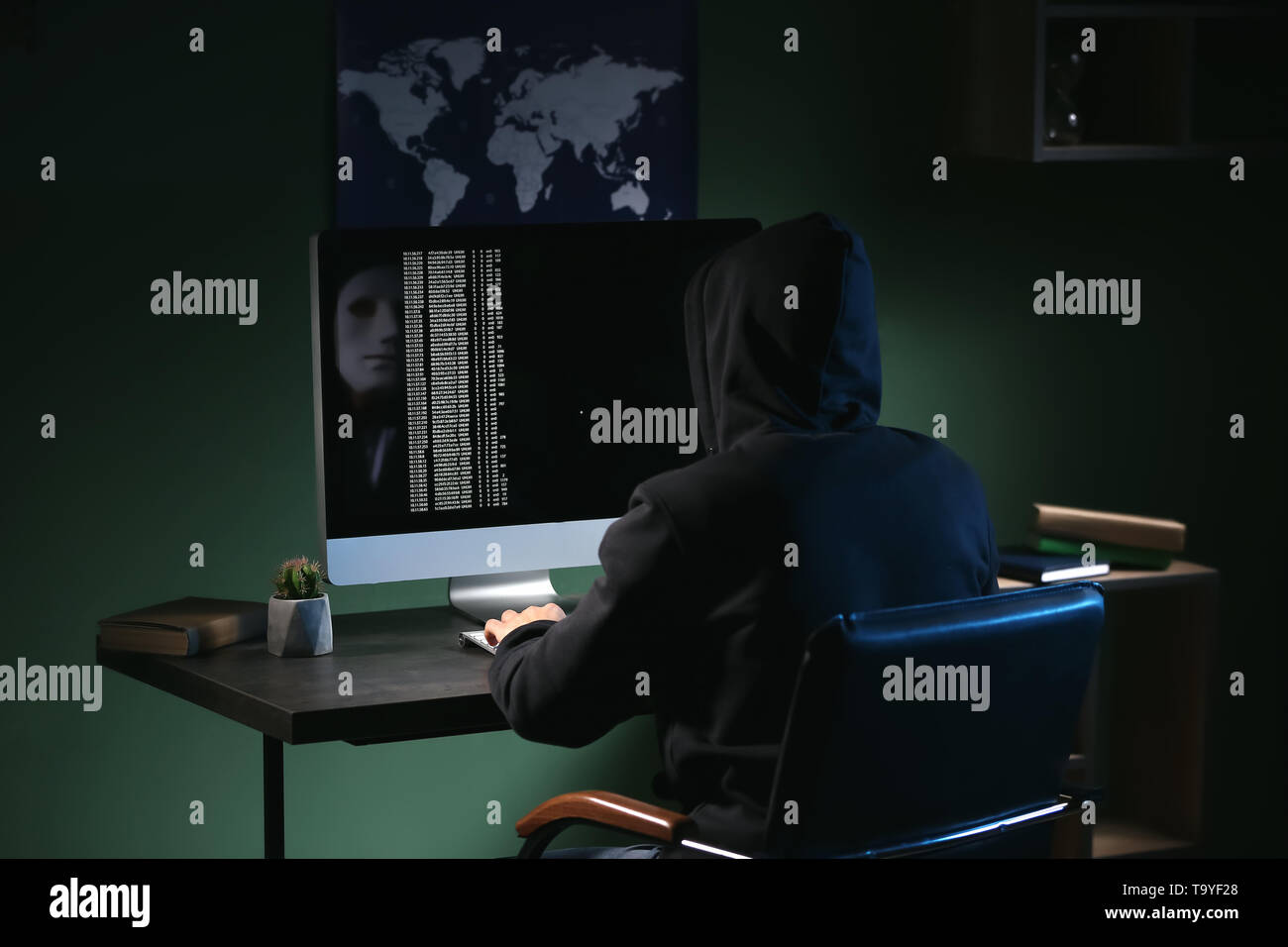 Professional hacker using computer in dark room Stock Photo - Alamy