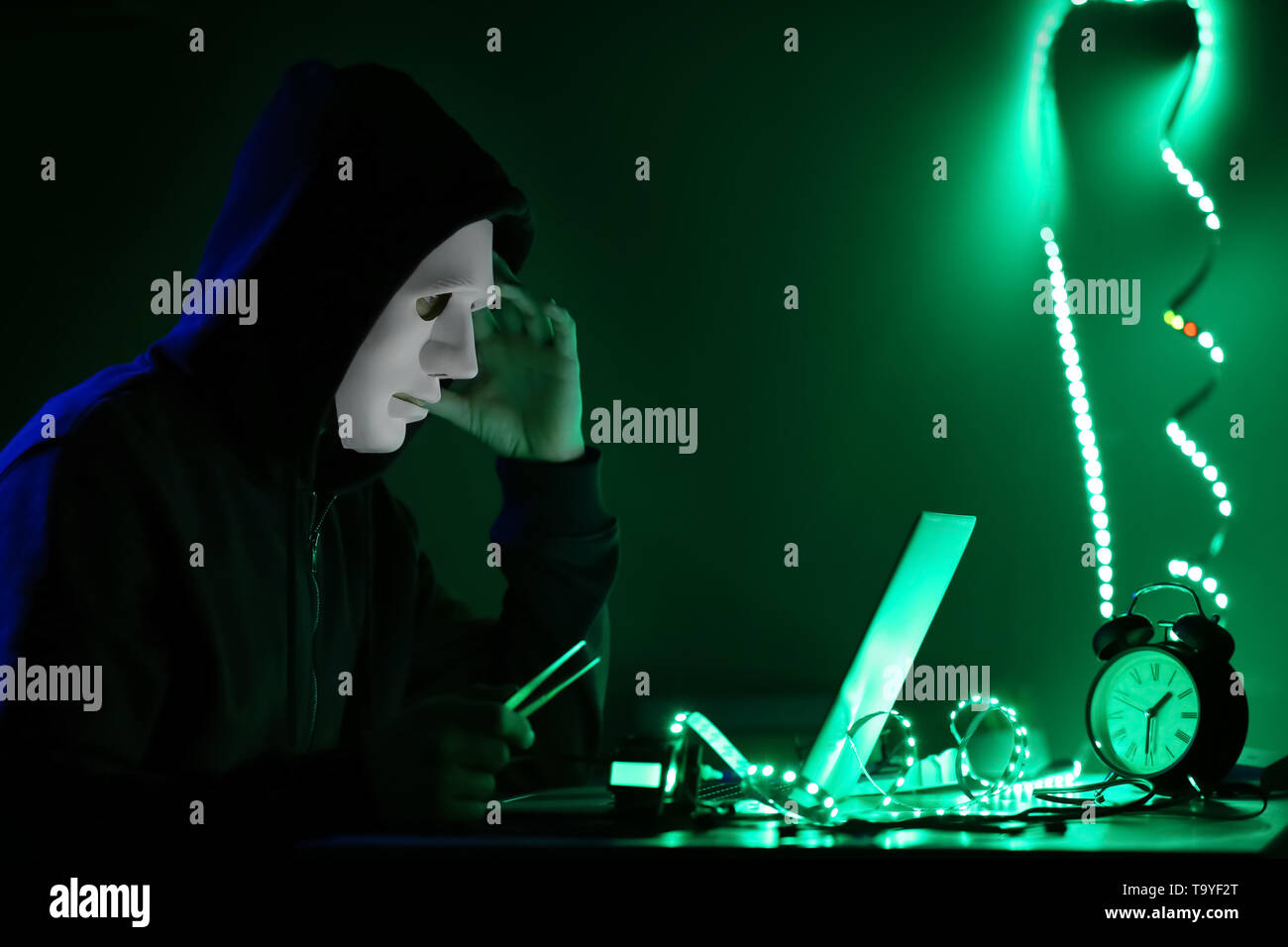 Professional hacker working in dark room Stock Photo - Alamy