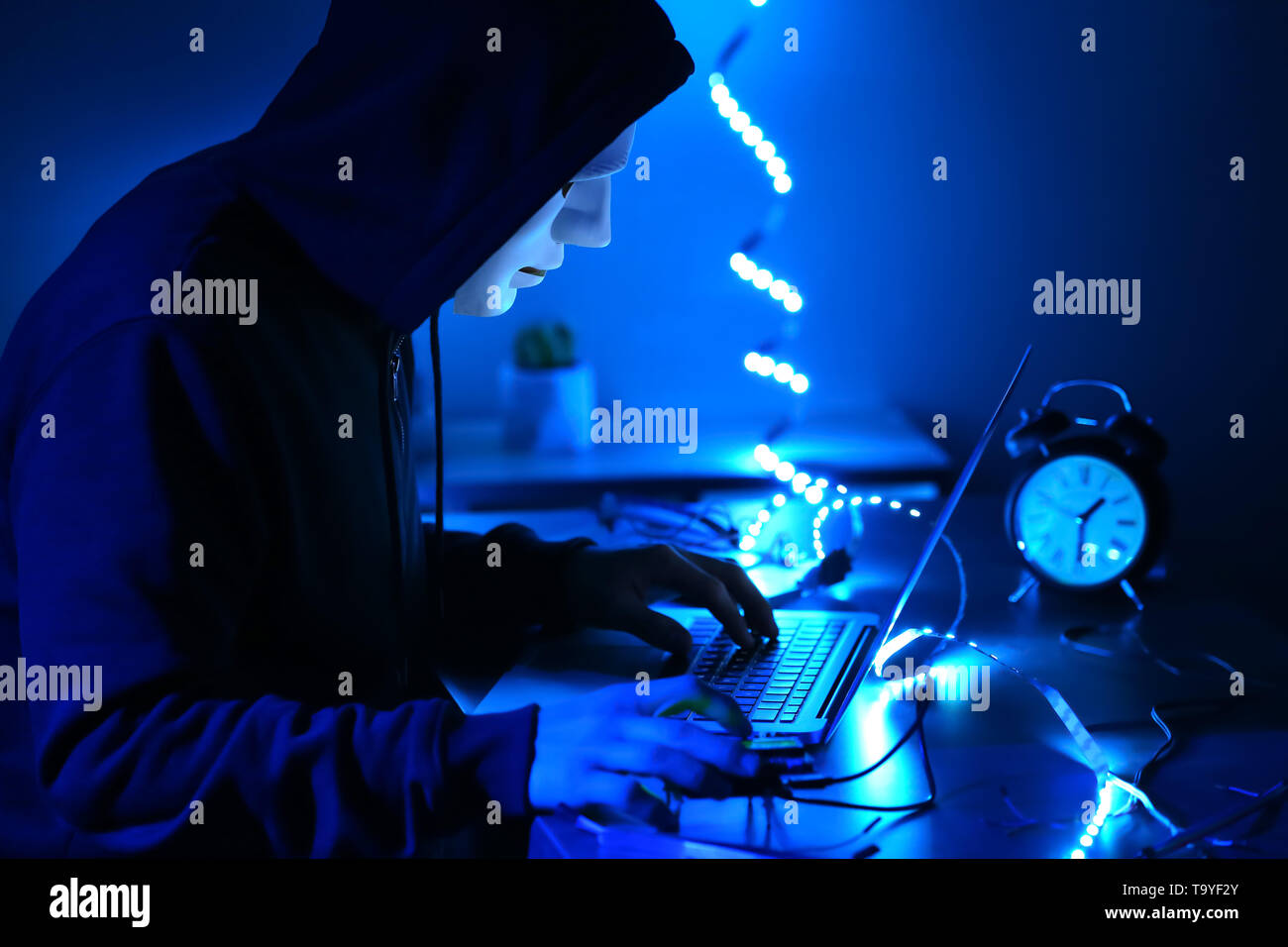 Professional hacker working in dark room Stock Photo - Alamy
