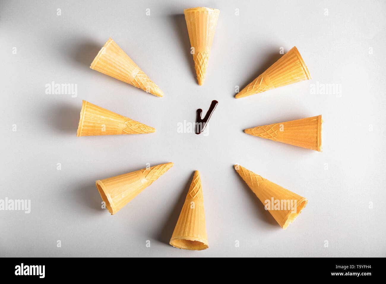 Clock made of waffle cones on light background Stock Photo - Alamy