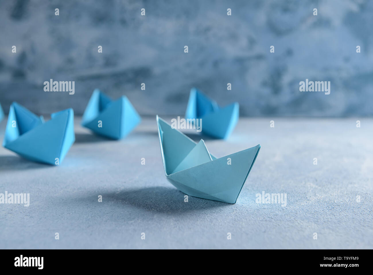 Origami boats on color table Stock Photo - Alamy