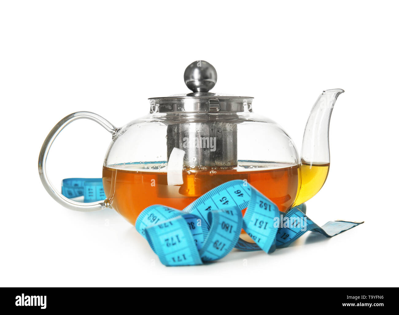 Teapot with measuring tape on white background. Weight loss concept ...