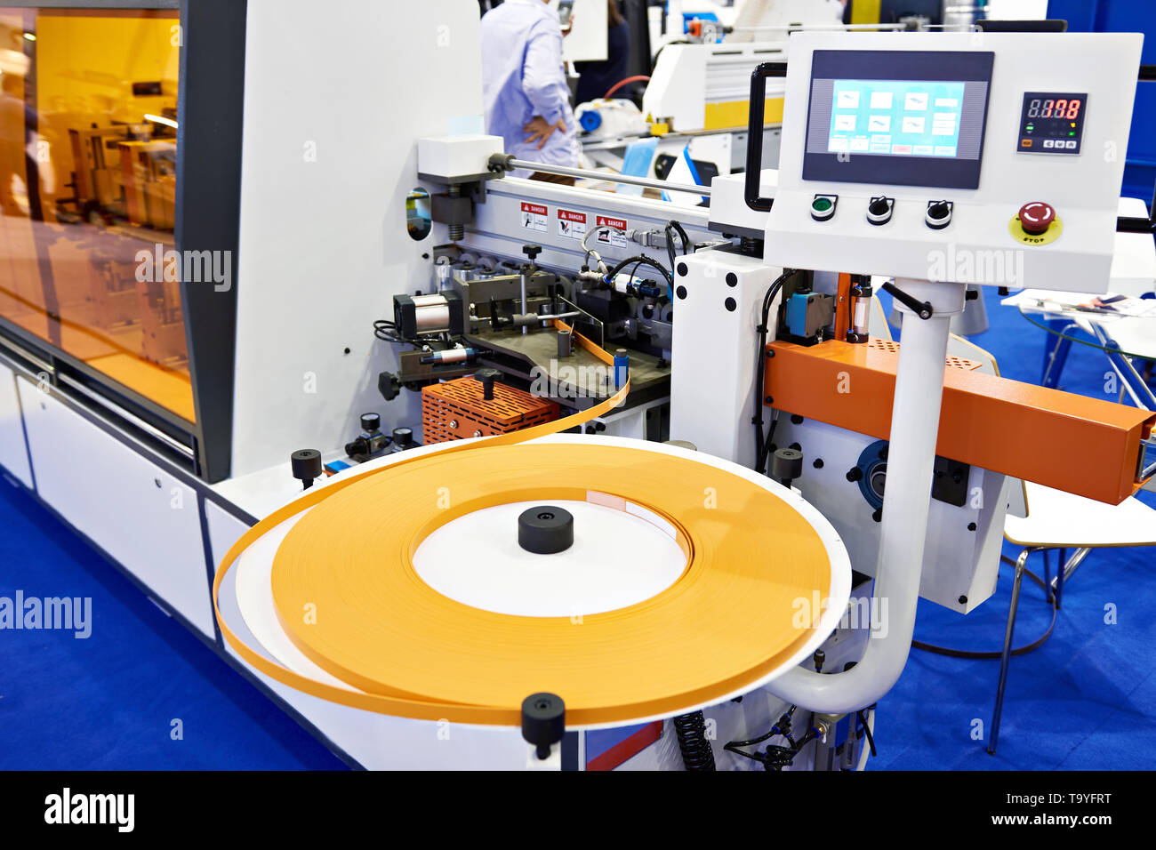 Single sided automatic edge banders on factory Stock Photo - Alamy