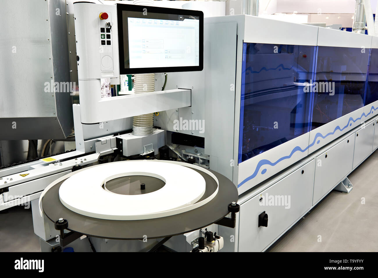 Single sided automatic edge banders on factory Stock Photo - Alamy
