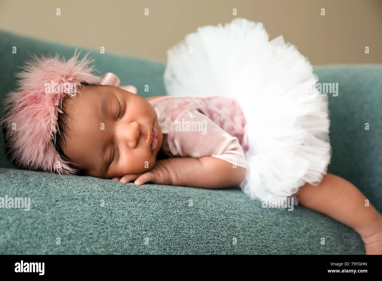 Portrait of cute African-American baby sleeping in soft armchair Stock ...