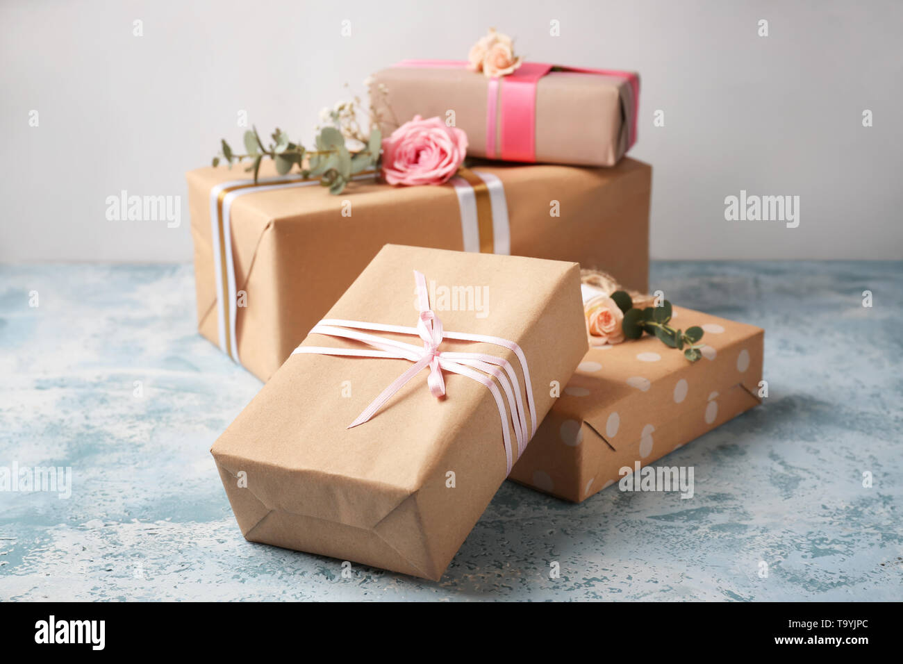 Festive gift boxes on table Stock Photo - Alamy
