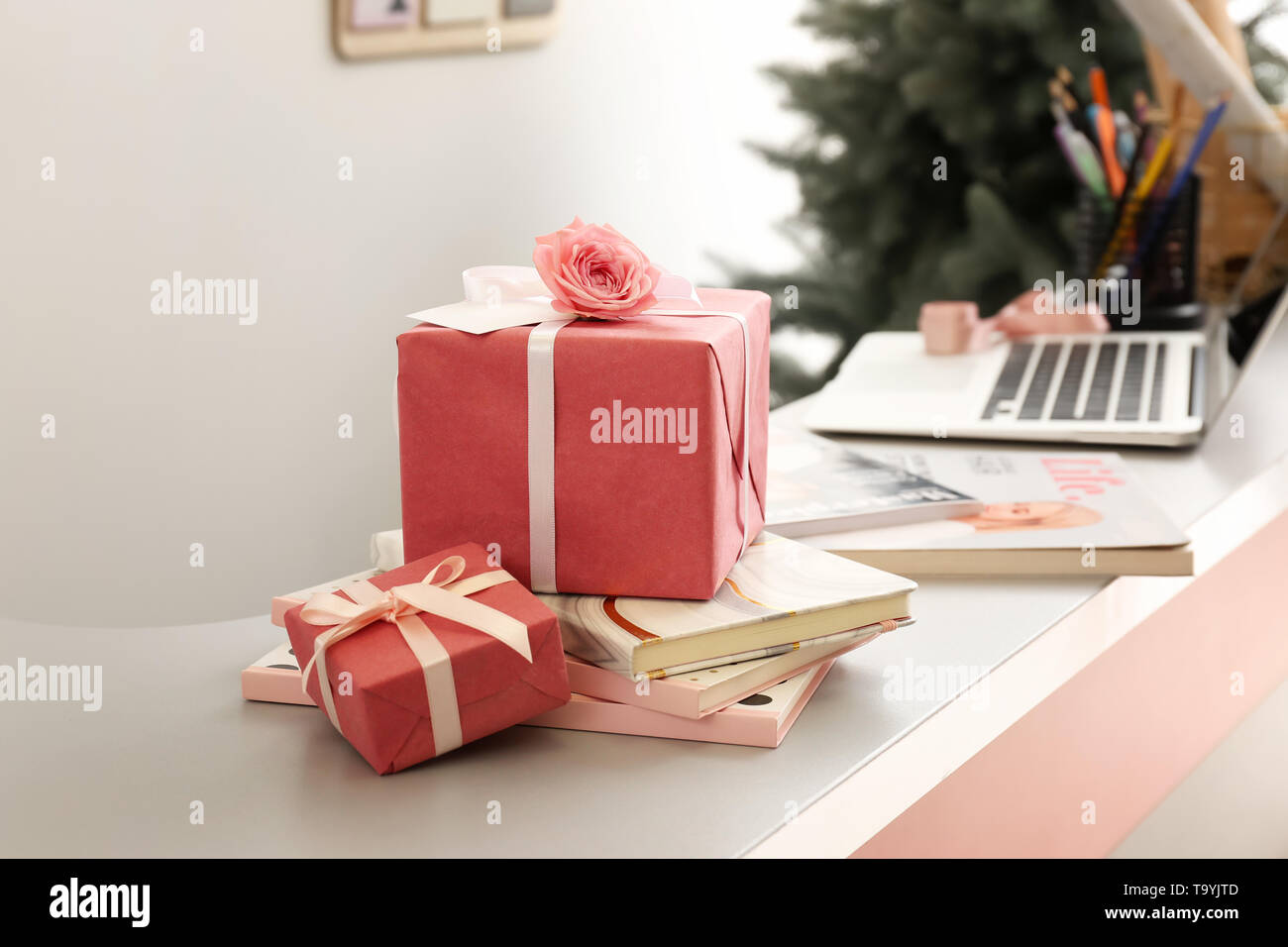 Christmas gift boxes on counter Stock Photo - Alamy