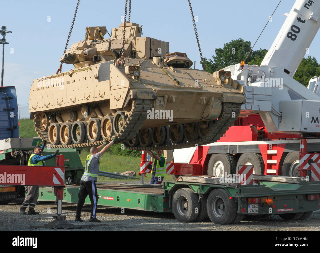 Bulgarian contractors load an M3 Bradley Fighting Vehicle assigned to ...
