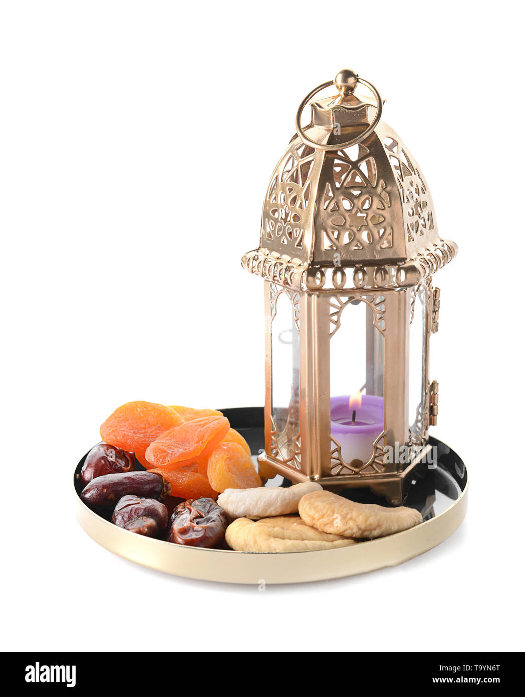 Muslim lamp as Ramadan symbol and dried fruits on white background ...