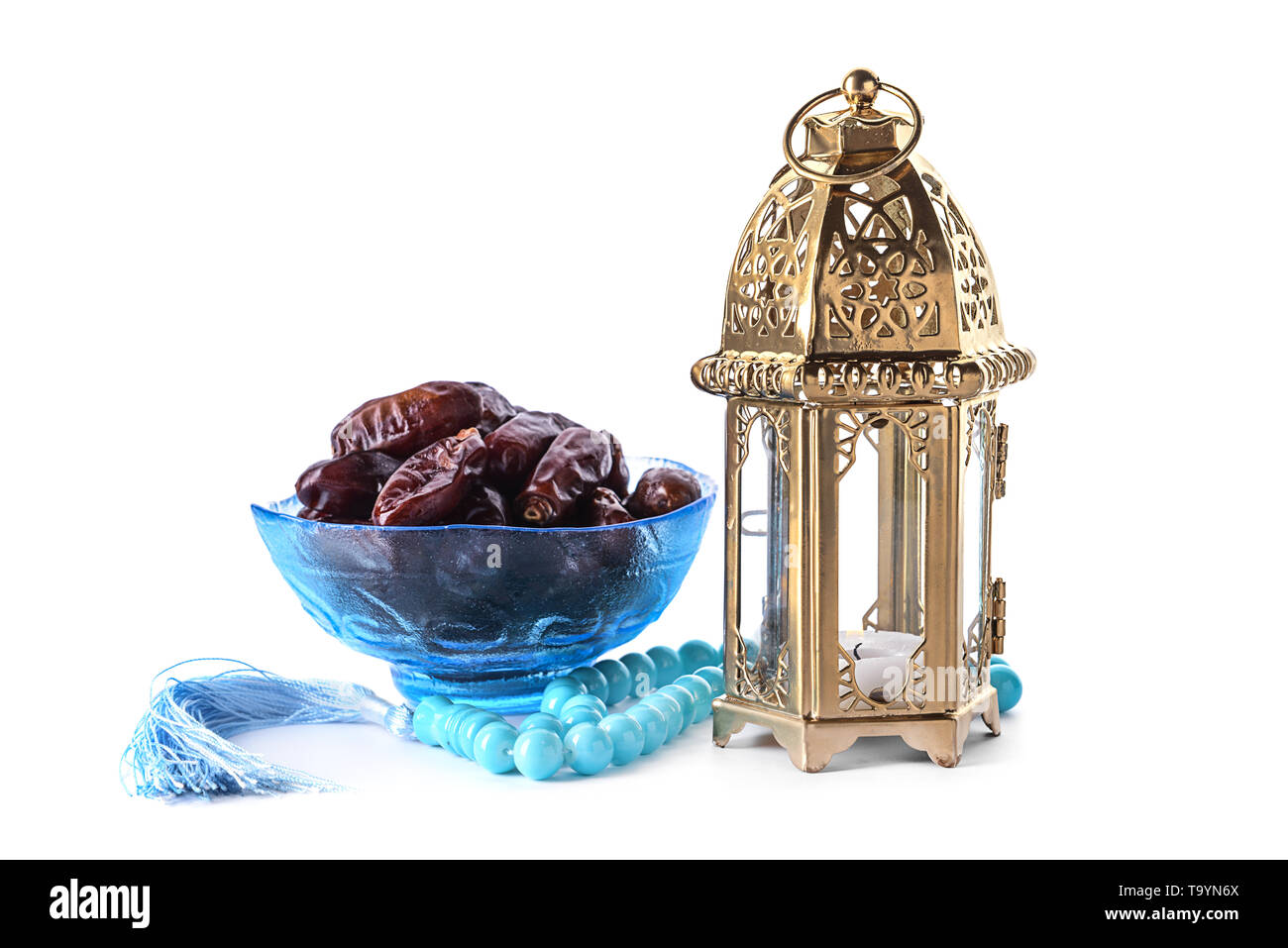 Muslim lamp as Ramadan symbol and dates on white background Stock Photo ...