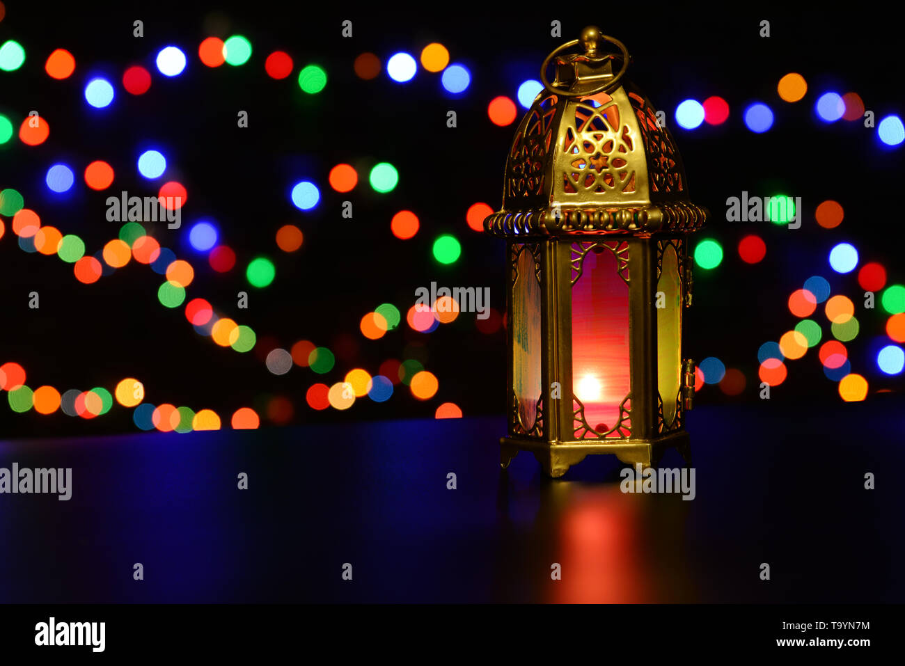 Muslim lamp as Ramadan symbol on dark background with defocused lights ...