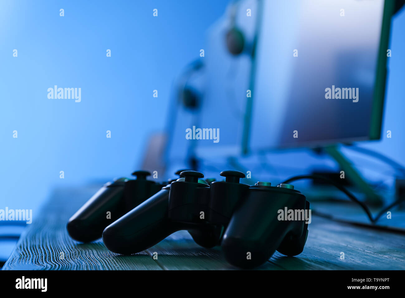 Game pads on table in computer club Stock Photo - Alamy