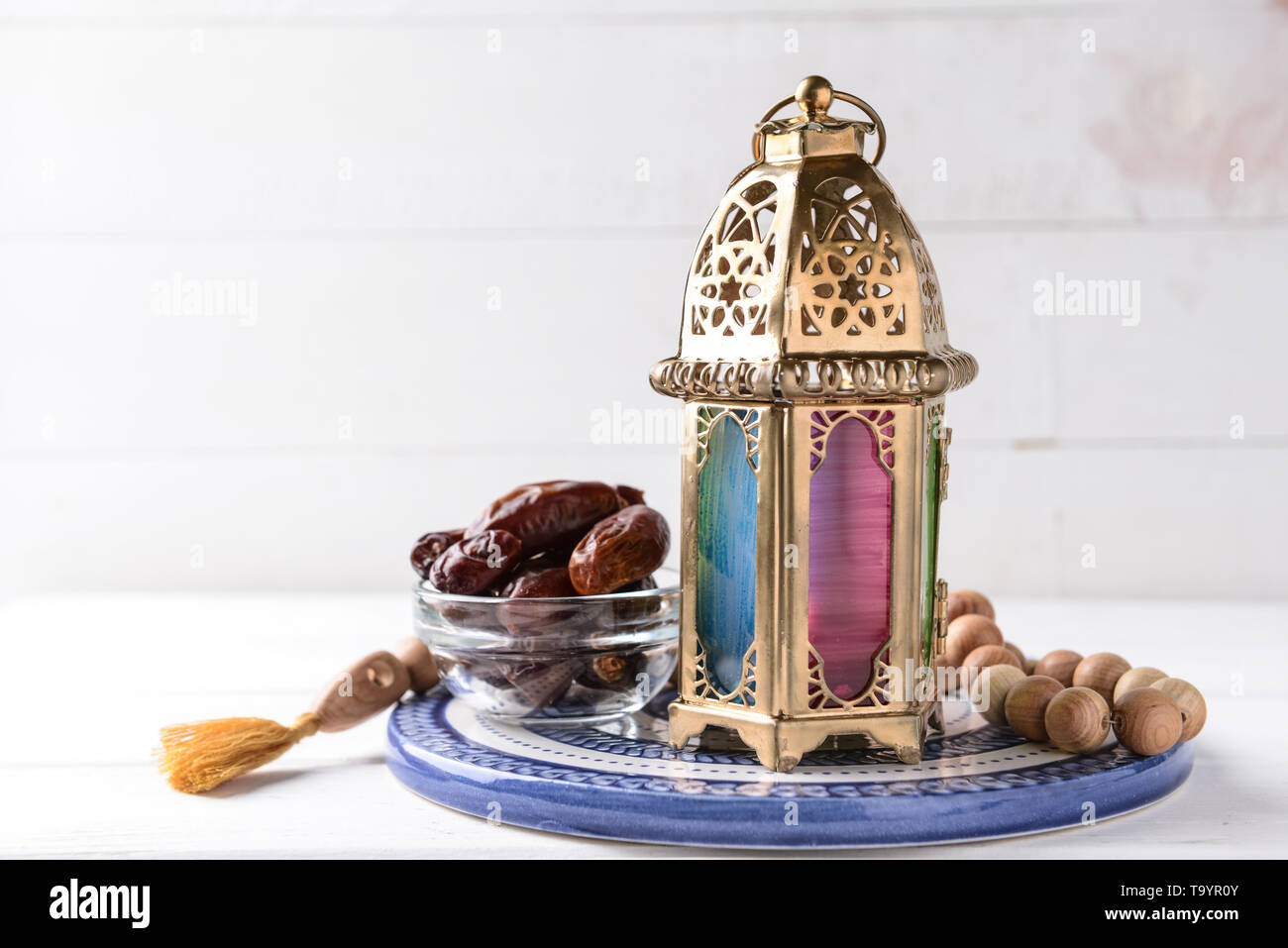 Composition with Muslim lamp on white wooden table Stock Photo - Alamy