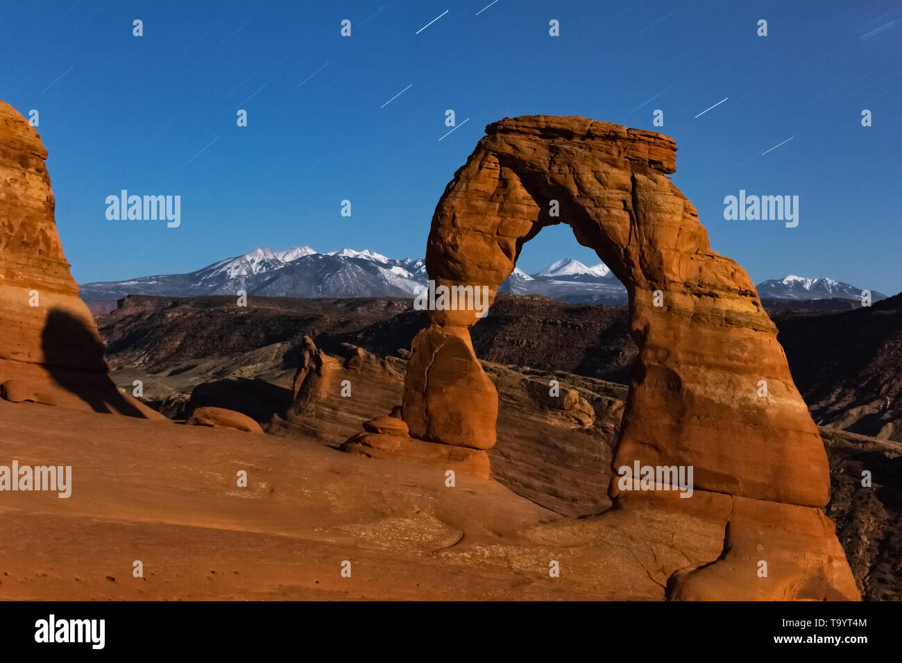 arch at night with startrails in the background Stock Photo - Alamy