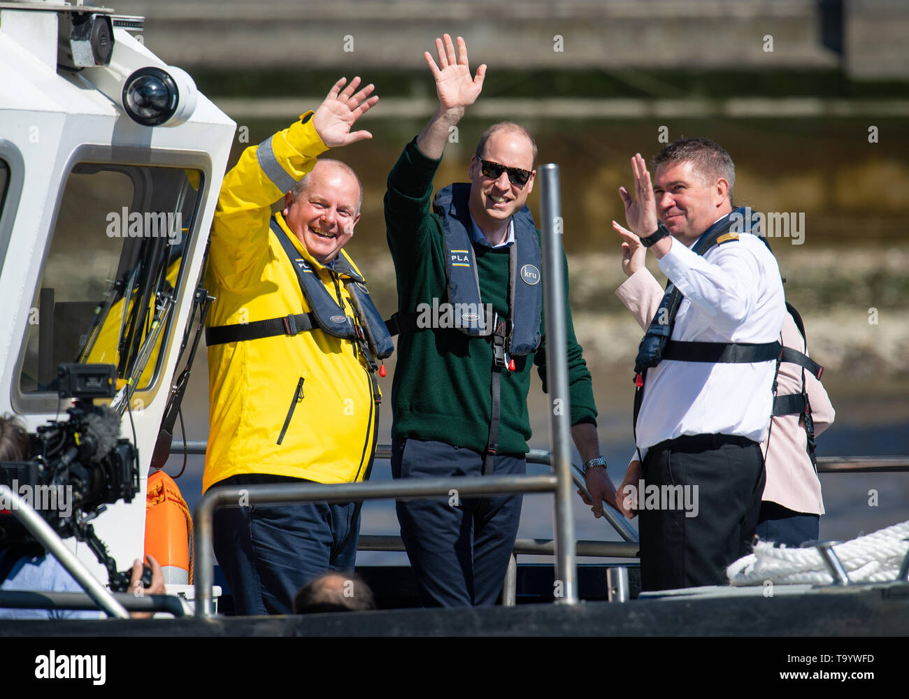 The Duke of Cambridge waves from a boat on the river Thames, during the ...