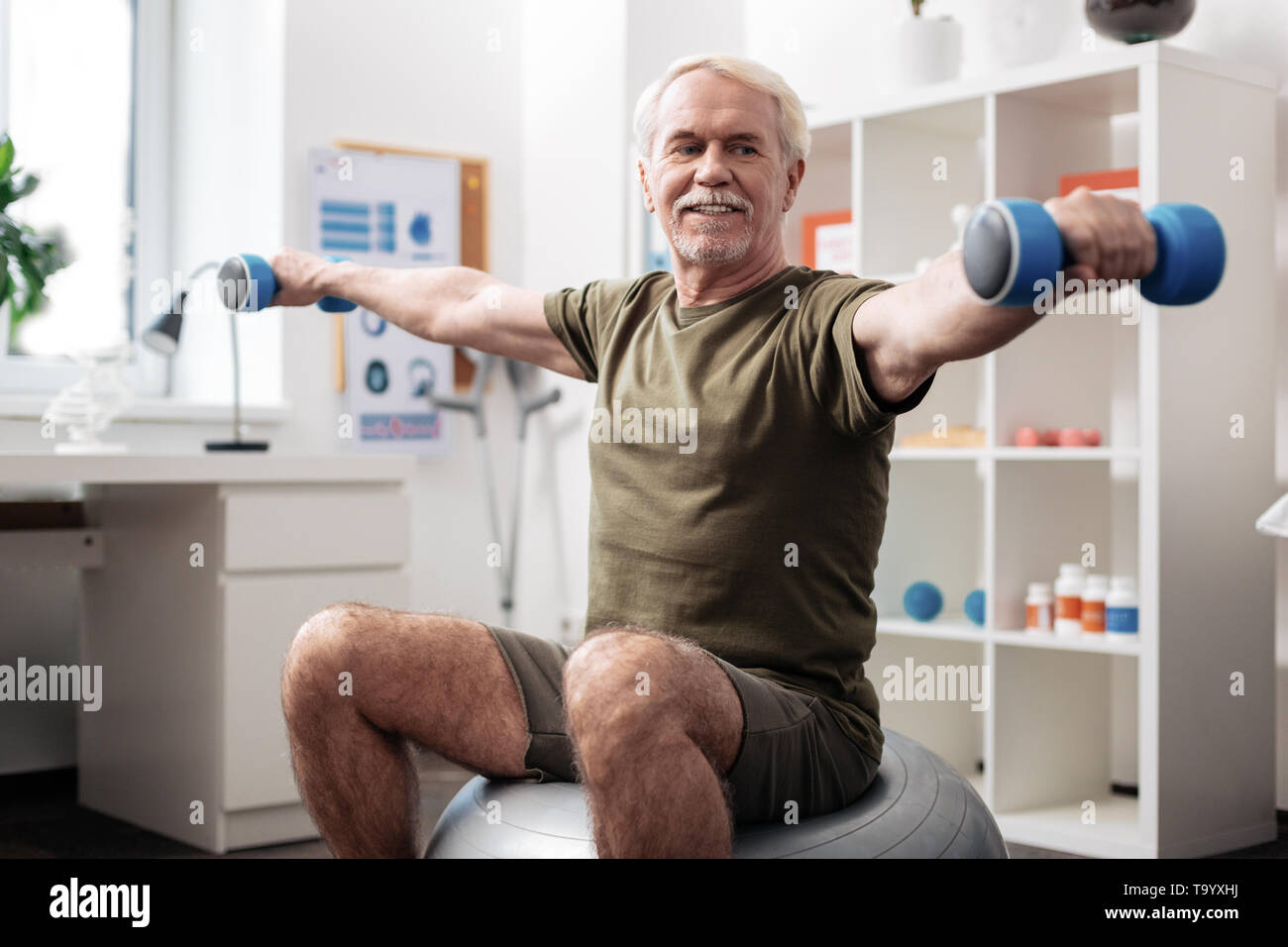 Joyful active man enjoying his physical exercises Stock Photo - Alamy