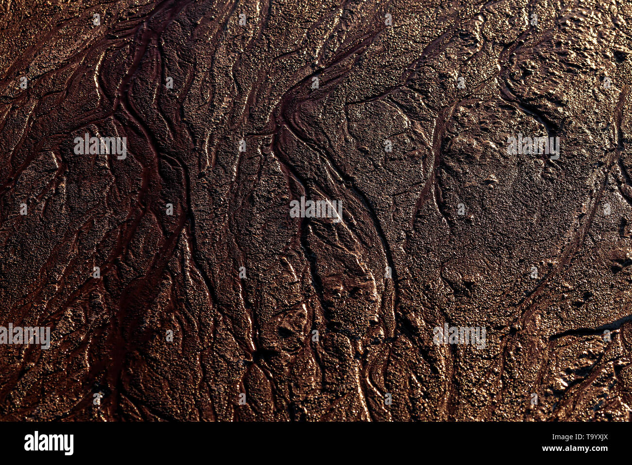 abstract mud background with water washout trails and selective focus ...