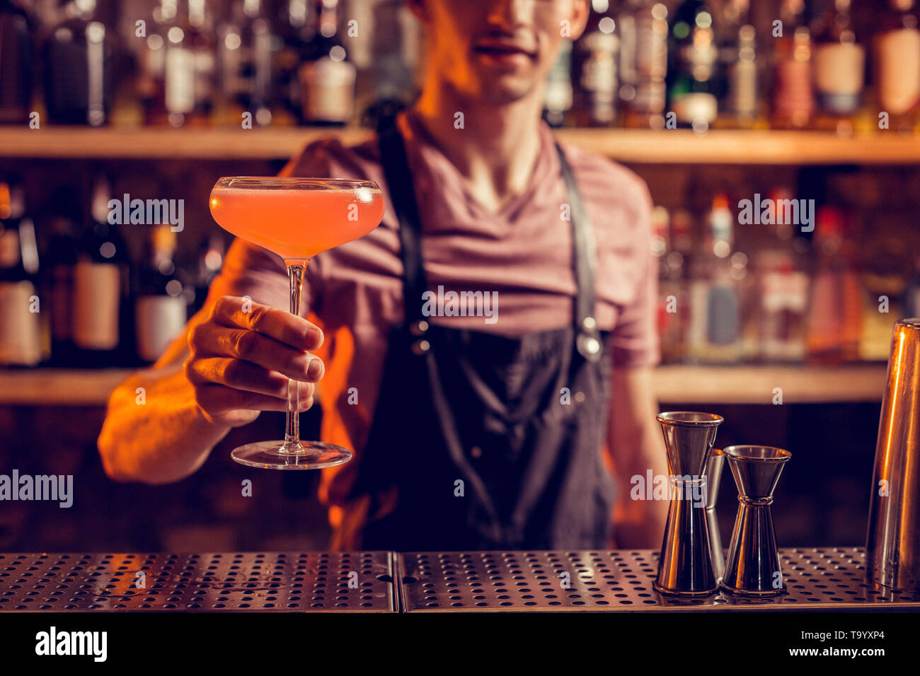 Barman making alcohol cocktail close hi-res stock photography and ...