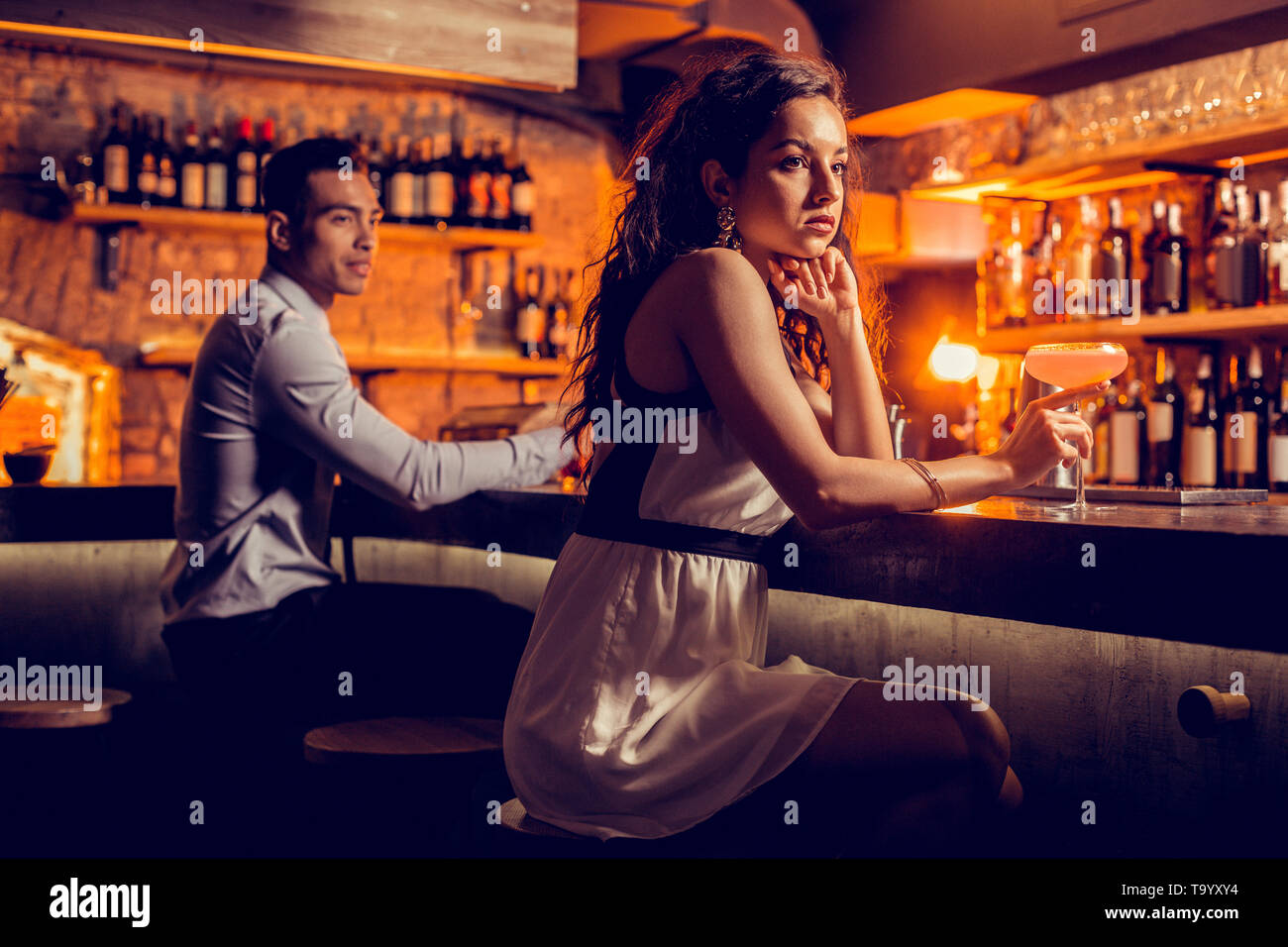 Woman feeling lonely without friends in the bar Stock Photo - Alamy