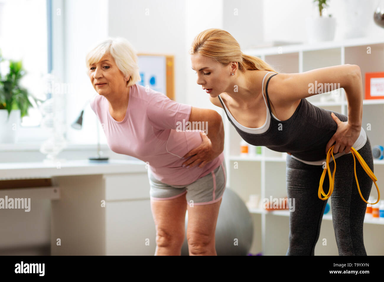 Woman leaning forward close hi-res stock photography and images - Alamy