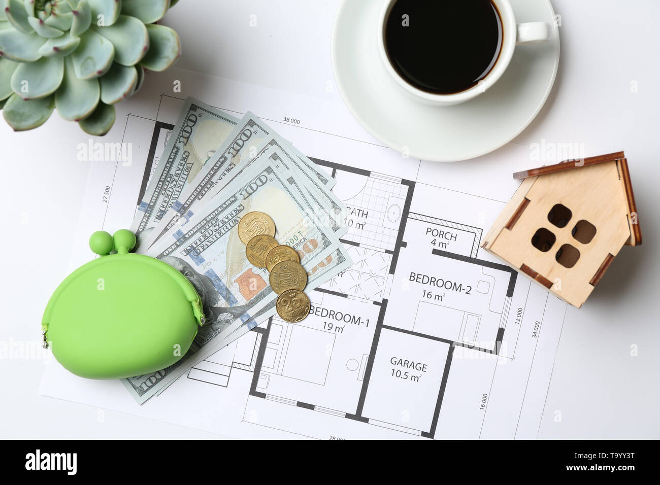 Composition with project of house, wallet and money on white background ...