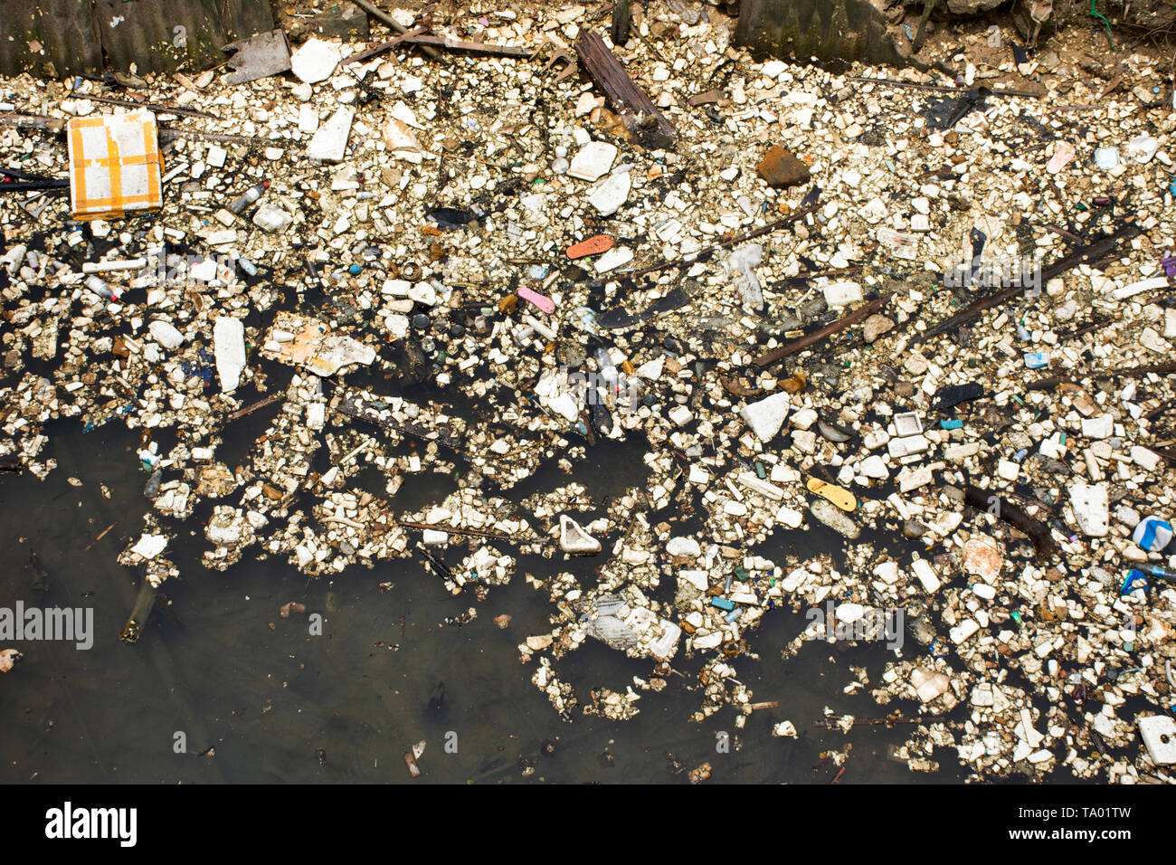 Many garbage and trash on surface of water in pond at outdoor in ...