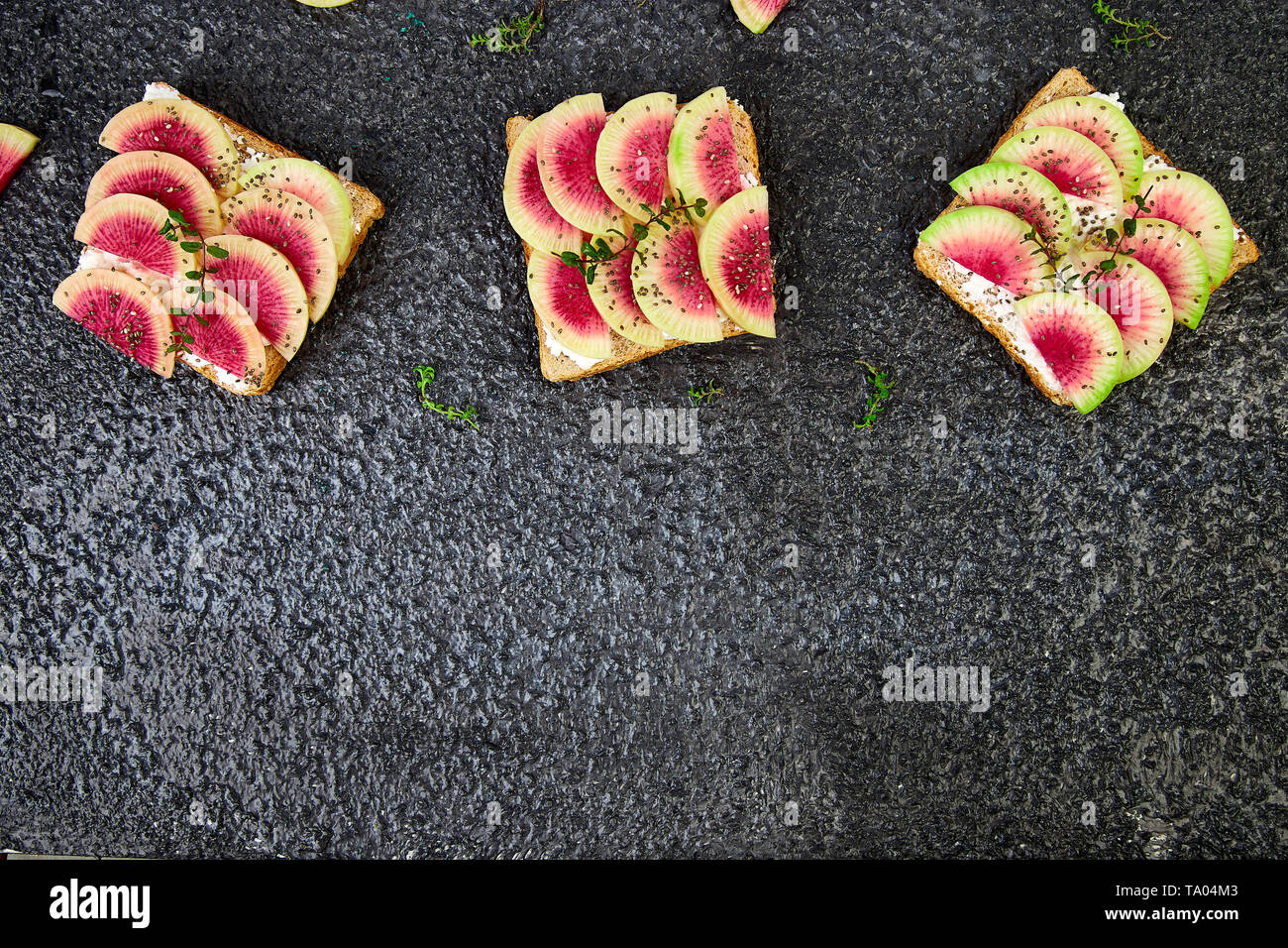 Healthy breakfast toasts from sliced watermelon radish or chinese ...