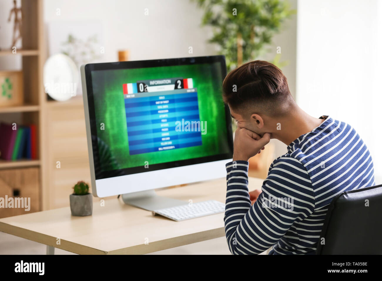 Upset young man after losing computer game at home Stock Photo - Alamy